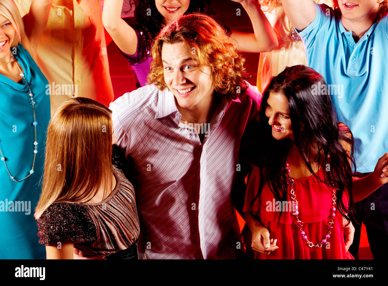 Joyful teens having nice time in night club Stock Photo - Alamy