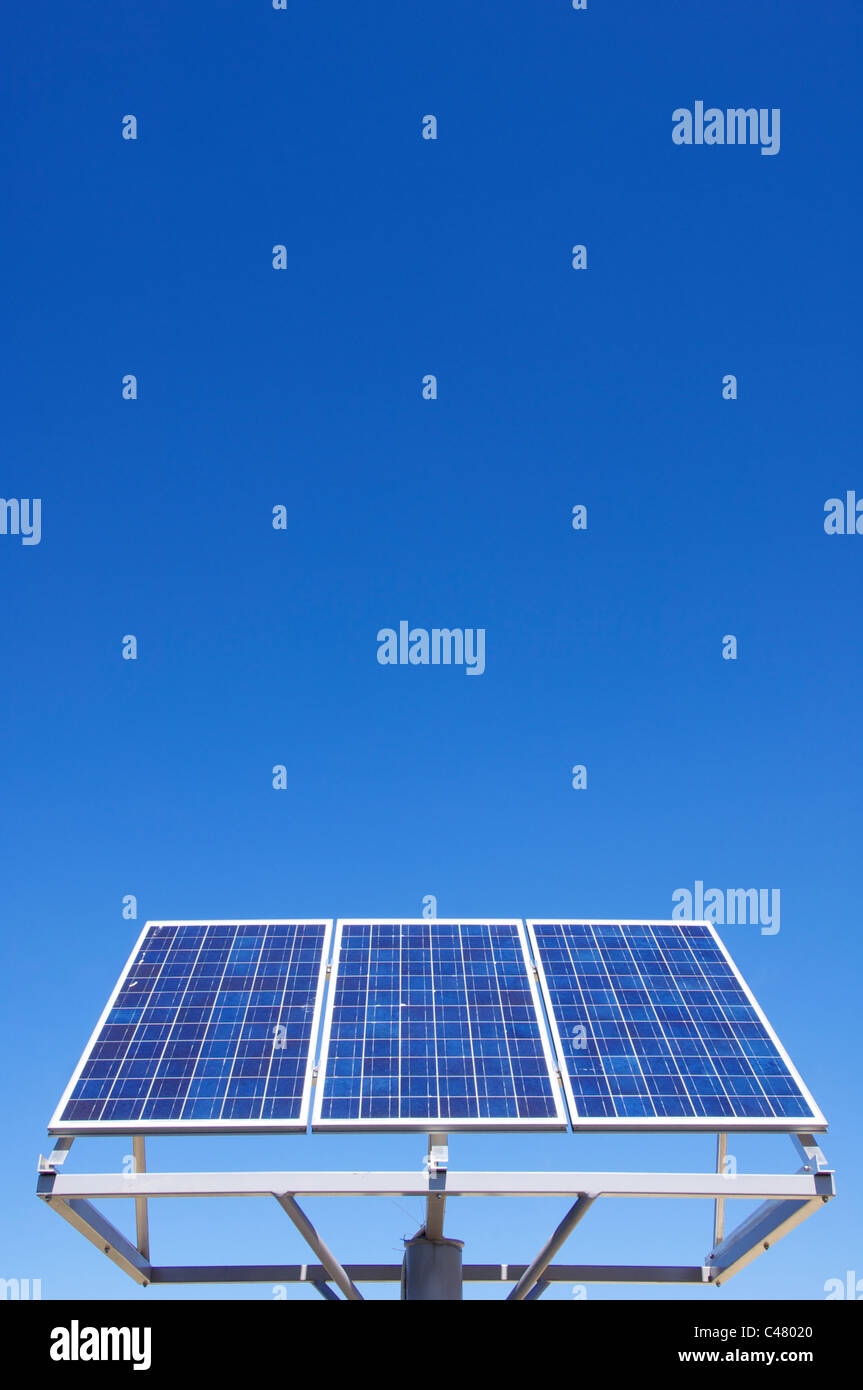 small photovoltaic panel against a clear blue sky Stock Photo - Alamy