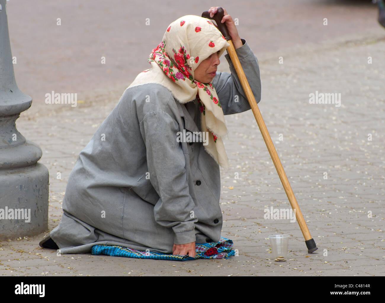 An old woman begging alms in the street Stock Photo - Alamy