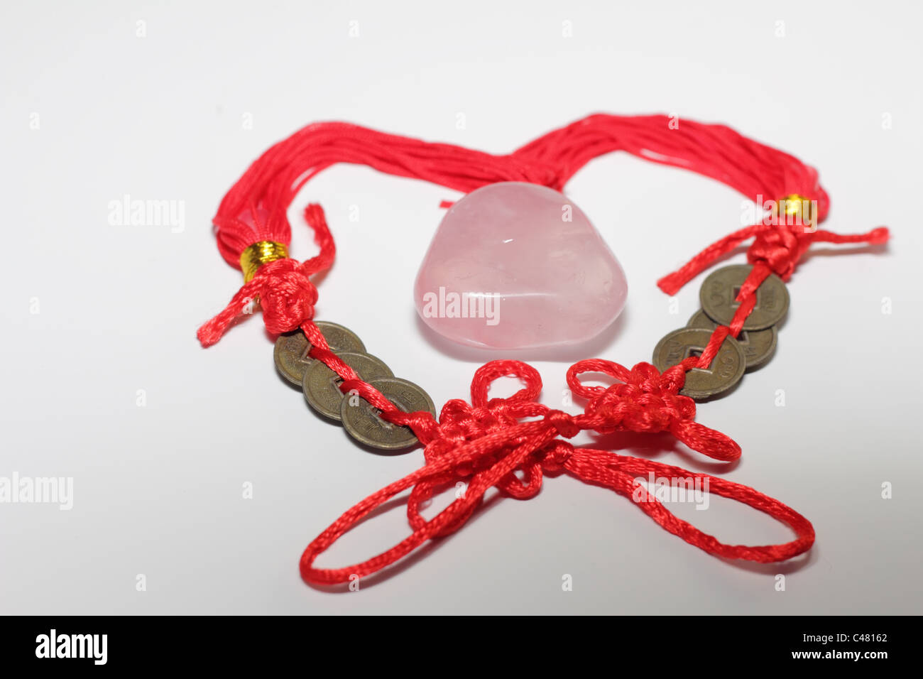 Two chinese knots are used to form a heart, representing luck in love ...