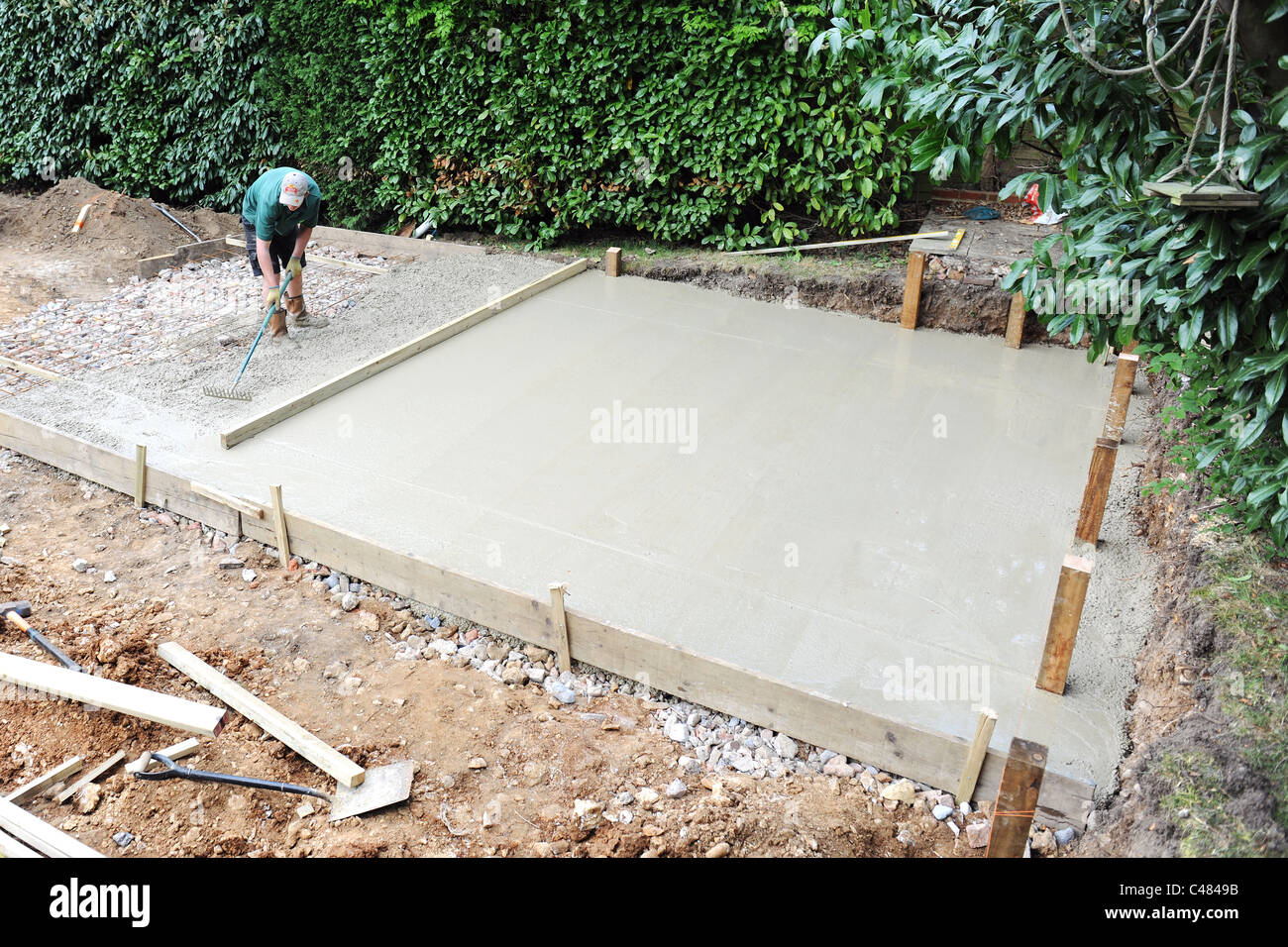 Cement / Concrete groundworks being laid and leveled outdoors Stock ...