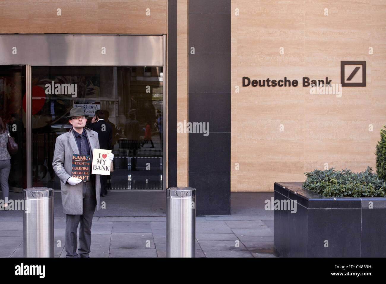 Supporters of a bank tax hold an anti-greed art giveaway of 300 signed ...