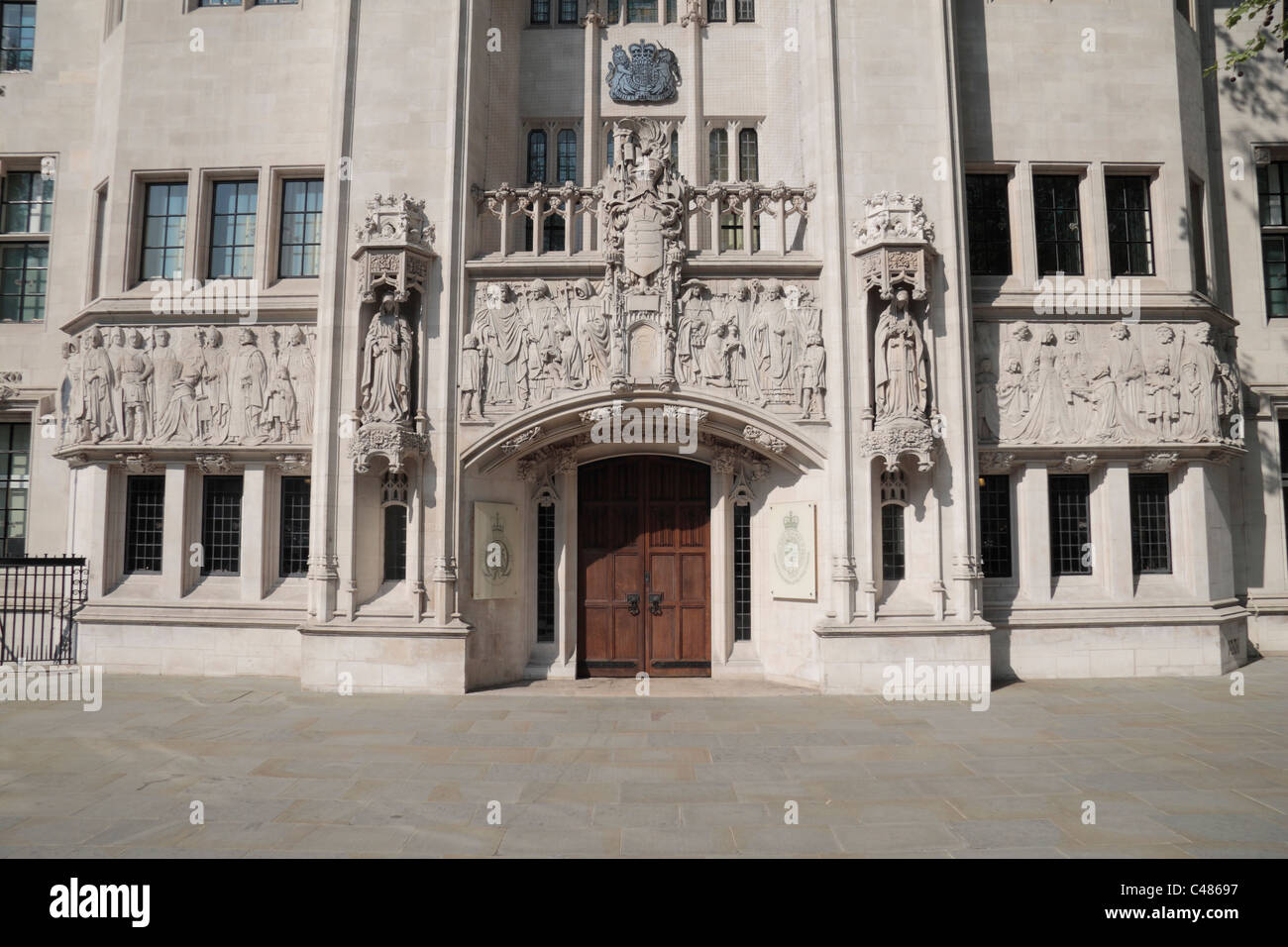 Ornamental statues, a piecework parapet and corner turrets above the ...