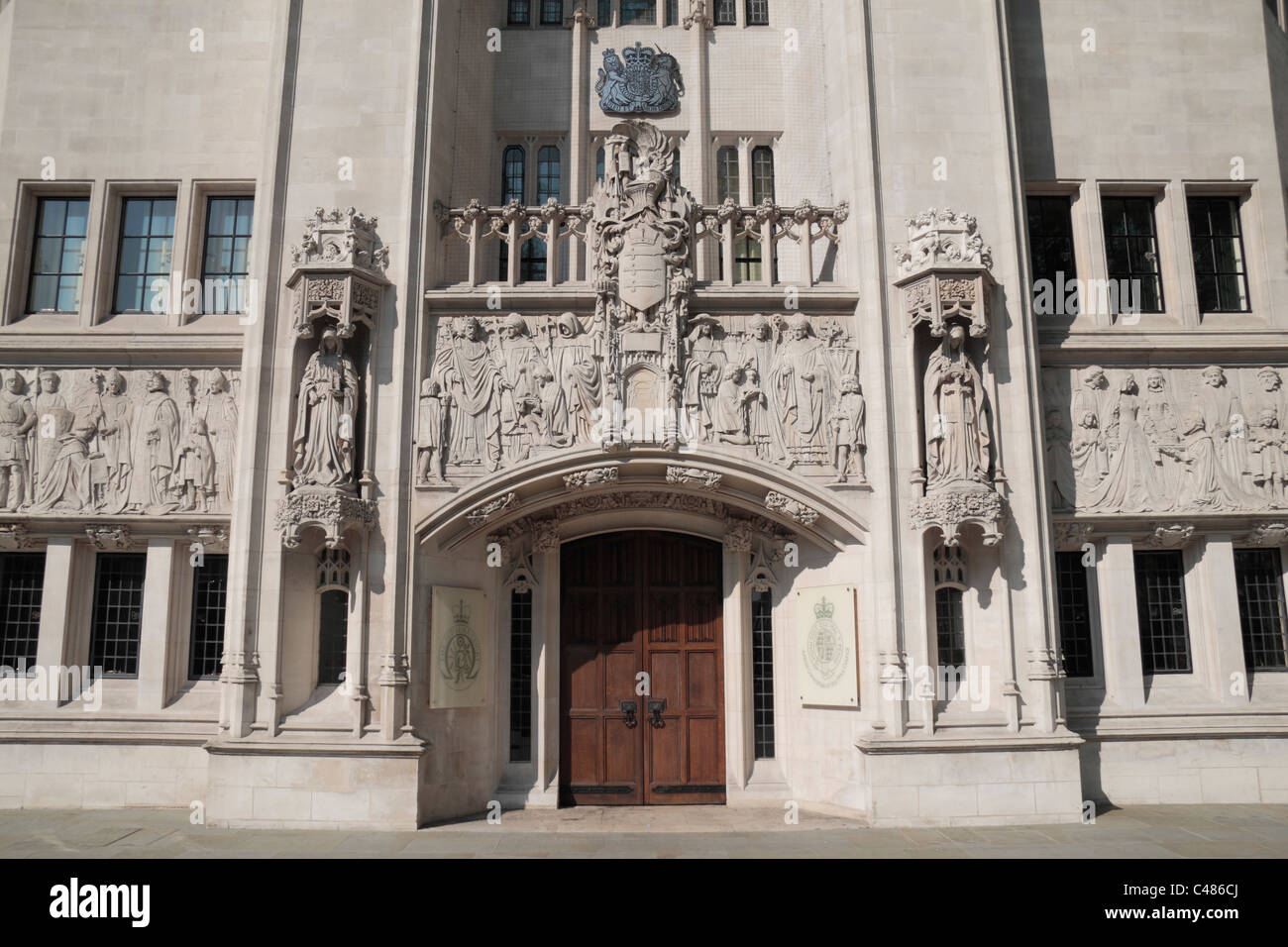 Ornamental statues, a piecework parapet and corner turrets above the ...