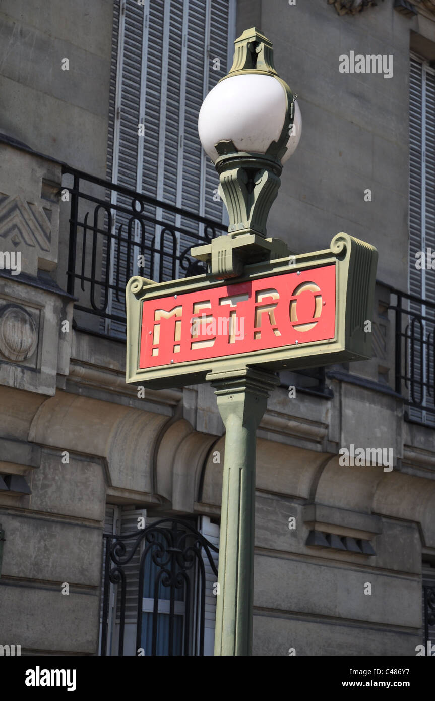 A bright red Metro sign on a sunny street in Paris Stock Photo - Alamy