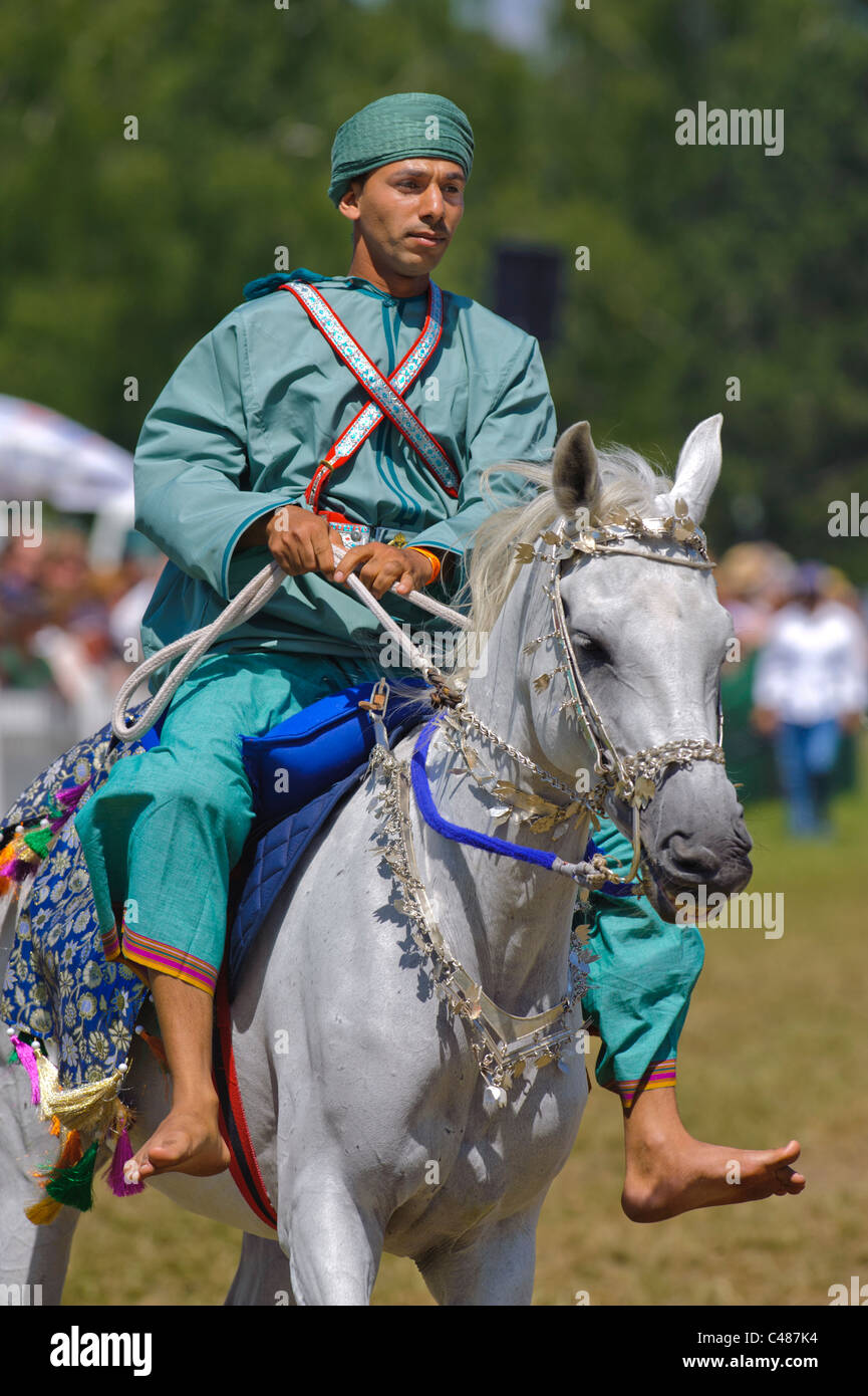 arabian Royal Cavalry of Oman in original costume on arabic horse while ...