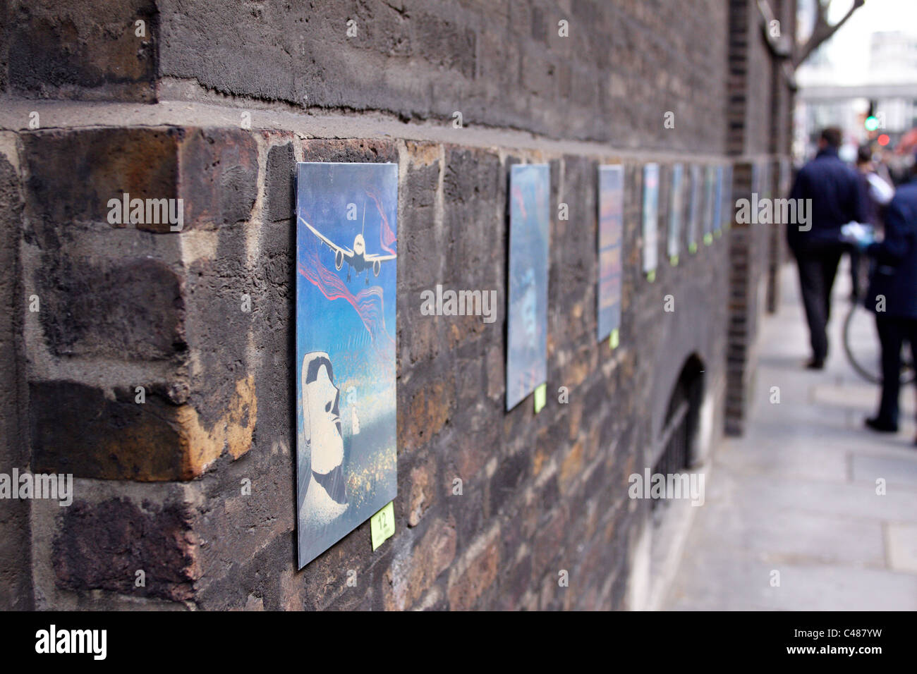 Supporters of a bank tax hold an anti-greed art giveaway of 300 signed ...