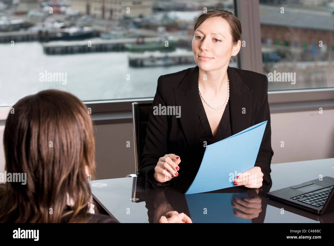 Job Interview in an office with panorama view Stock Photo - Alamy
