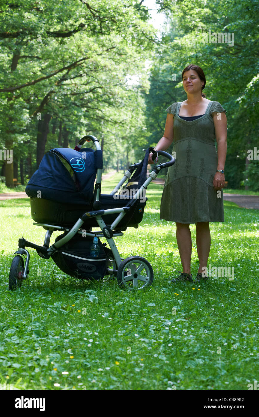 Pushing a babies pram hi-res stock photography and images - Alamy