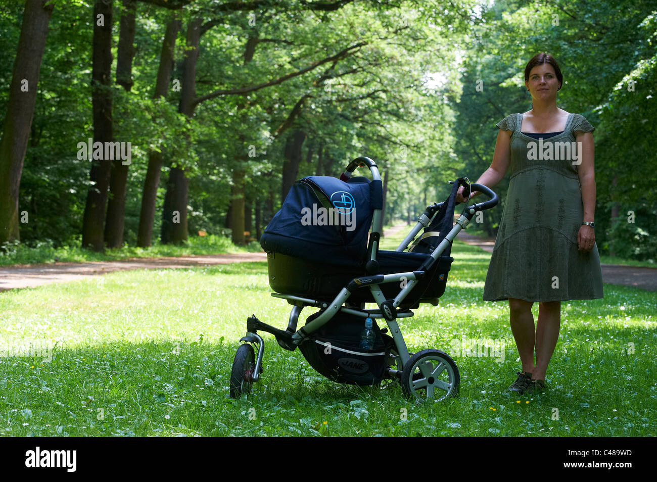 Pushing a babies pram hi-res stock photography and images - Alamy