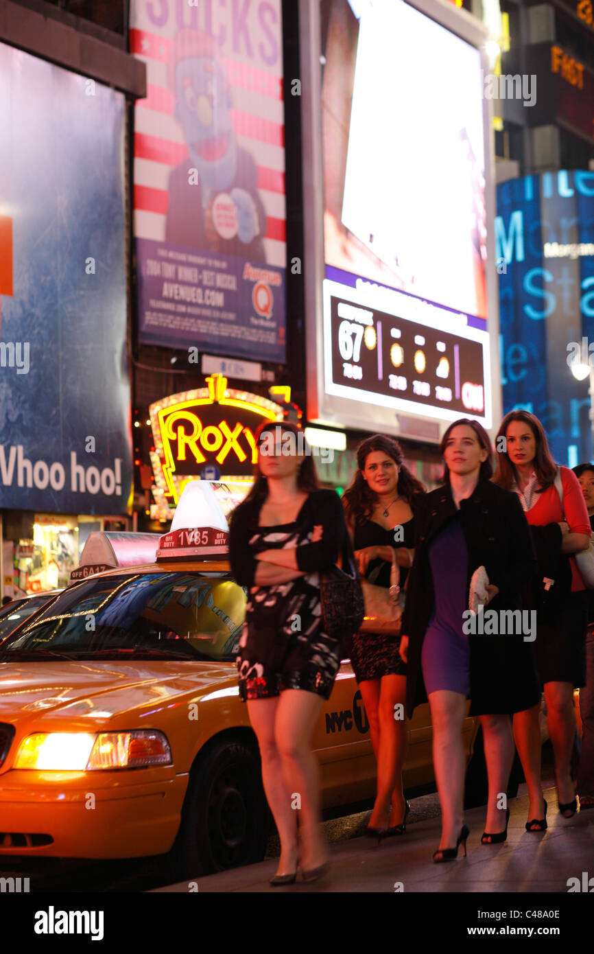 Four young women in Times Square, New York City, USA Stock Photo - Alamy