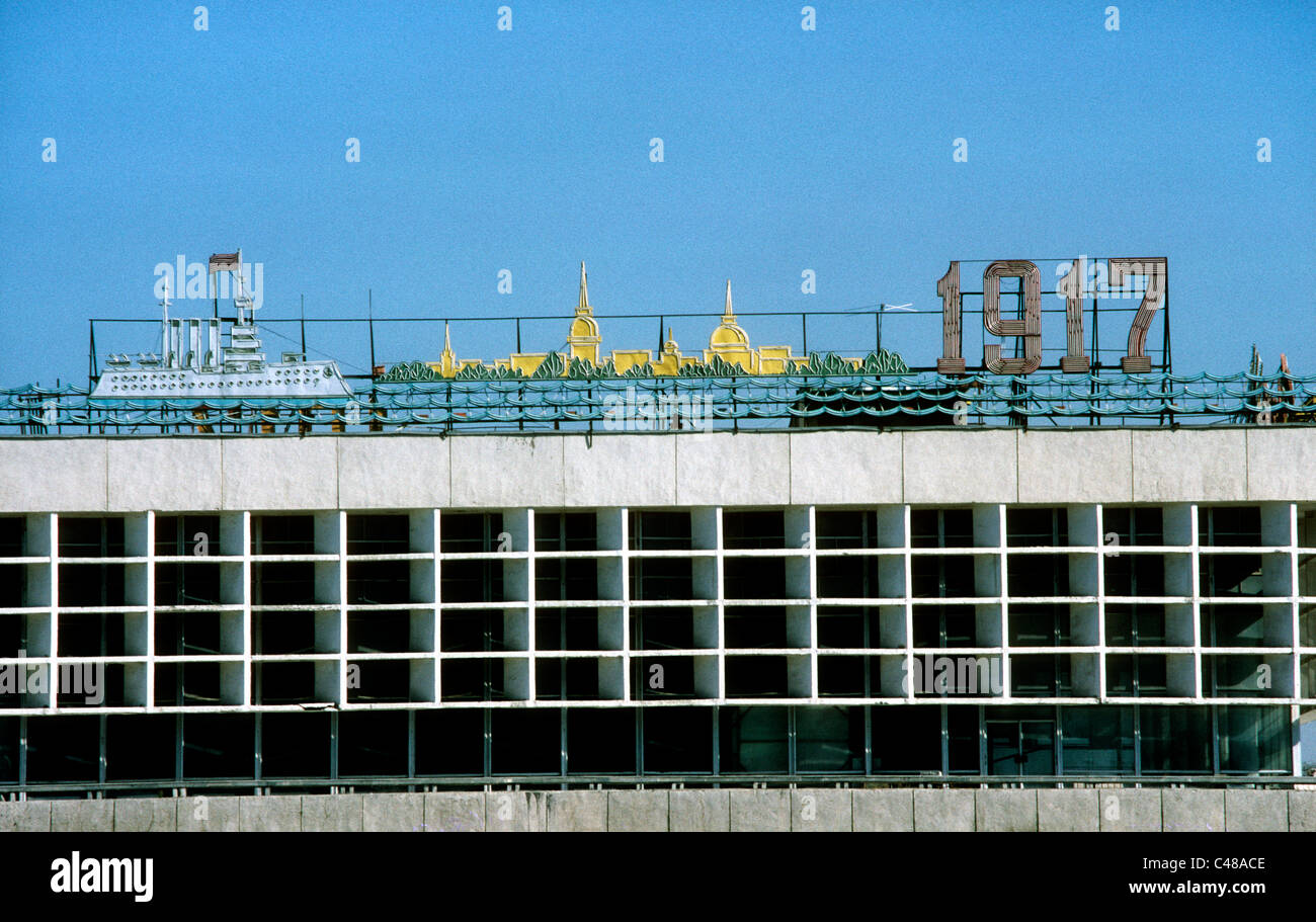 A soviet-era neon sign commemorating the Russian Revolution, on top of ...