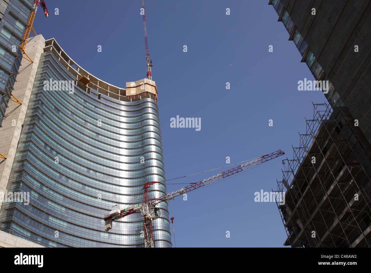 The modern skyscrapers under construction in Porta Nuova, Milan, Italy ...