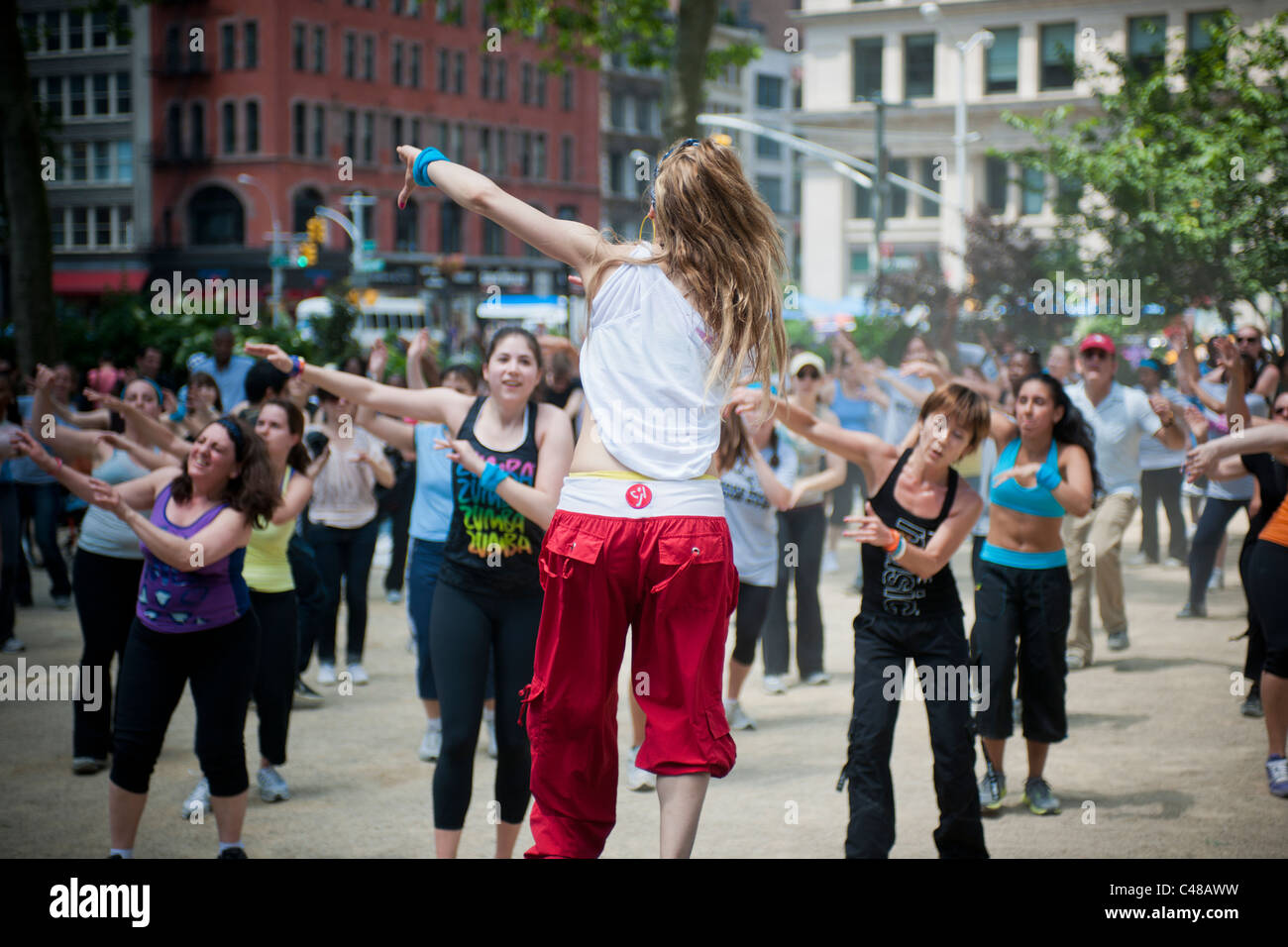 Exercisers participate in a Zumba class in Madison Square Park in New ...
