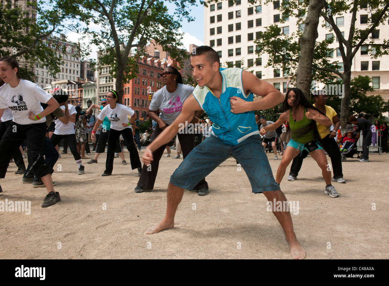 Exercisers participate in a Zumba class in Madison Square Park in New ...