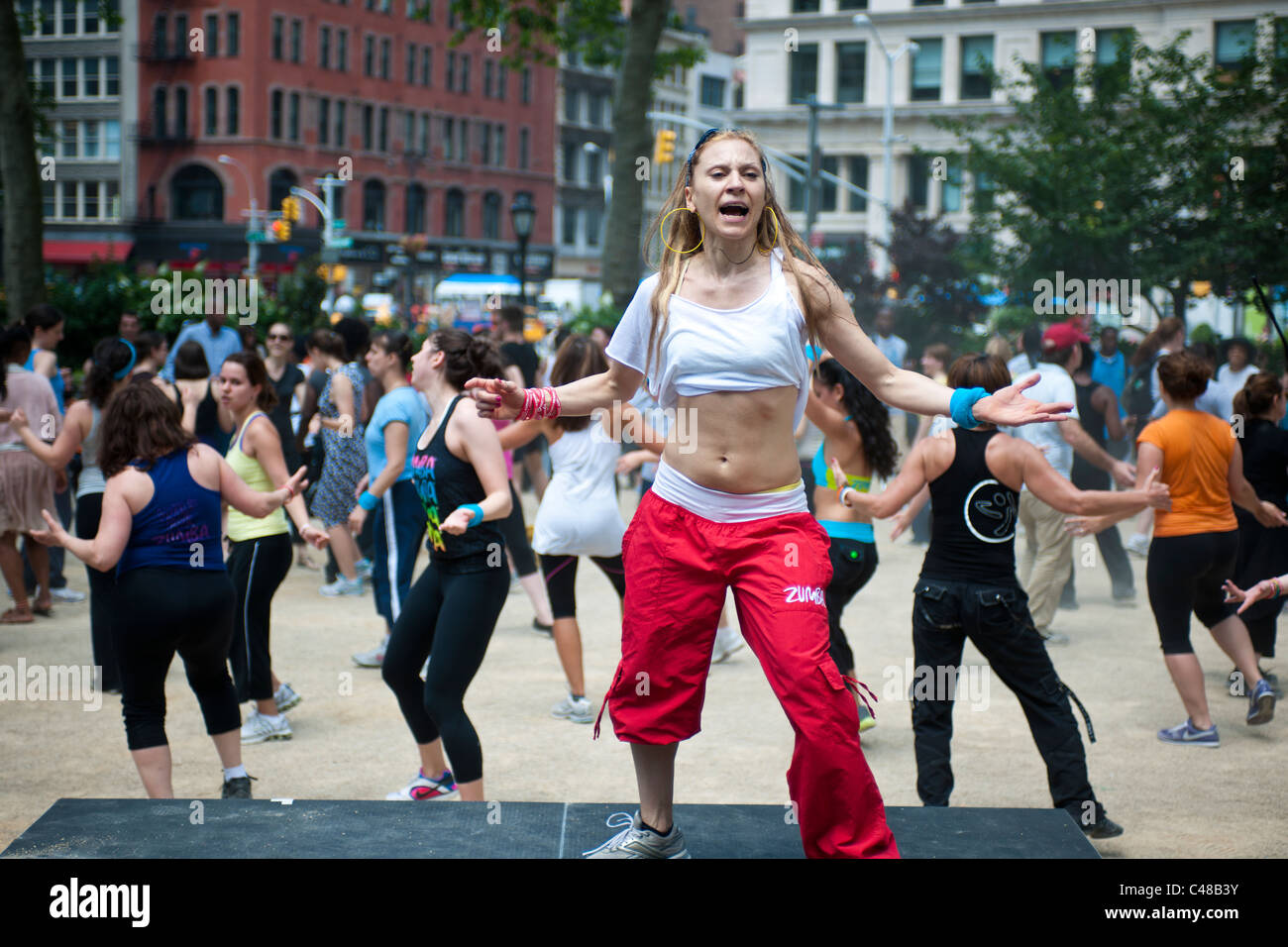Exercisers participate in a Zumba class in Madison Square Park in New ...