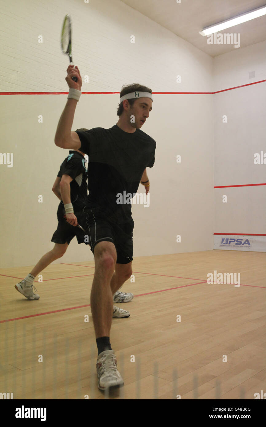 Squash player preparing to hit a forehand Stock Photo - Alamy