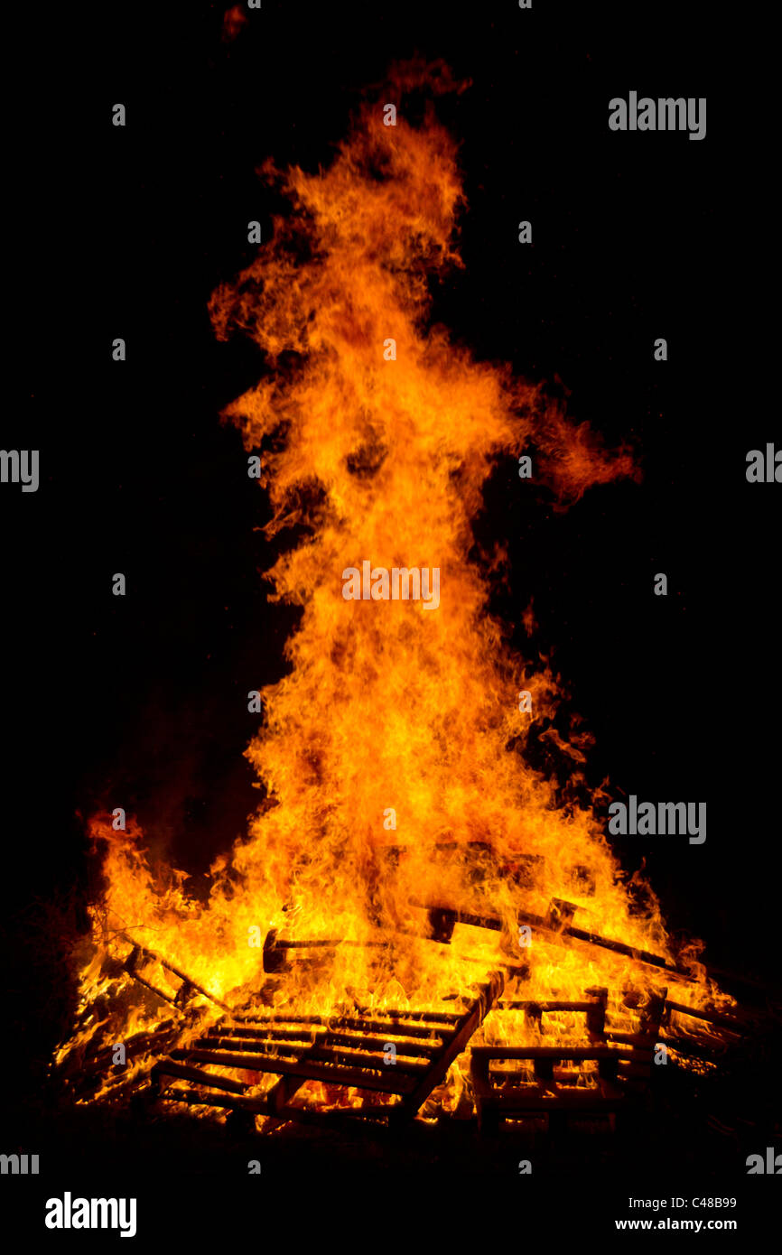 A roaring bonfire set against a black sky Stock Photo - Alamy