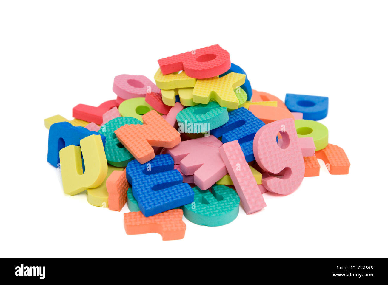 Pile of foam letters on white background Stock Photo - Alamy