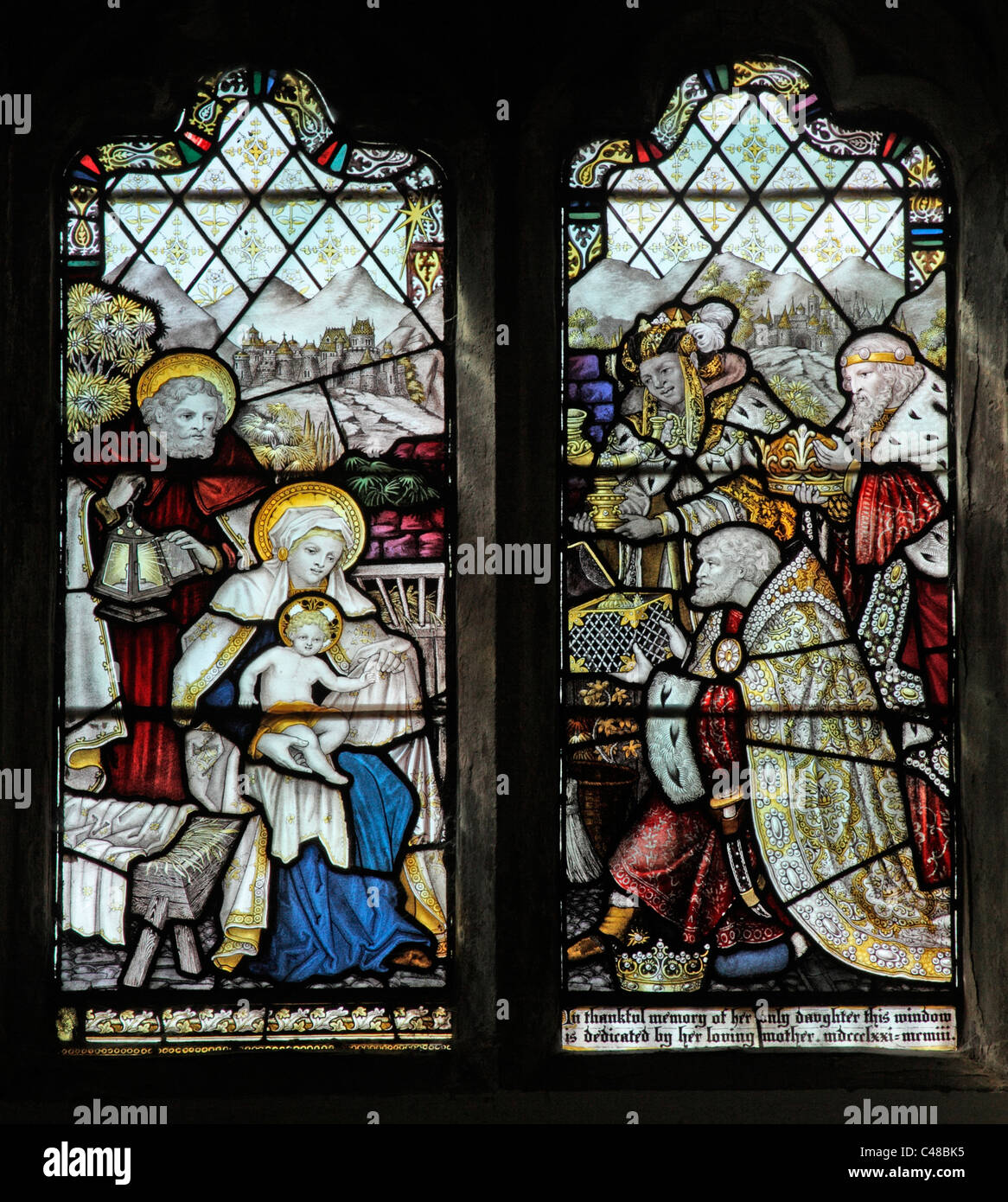 A stained glass window by The Kempe Studios depicting Adoration of the ...