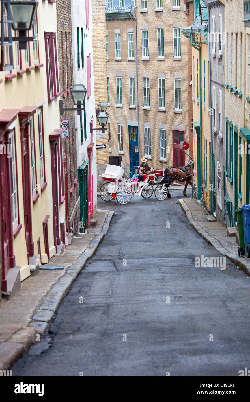 Chinese tourists in a horse carriage in Old town, Quebec City, Quebec ...