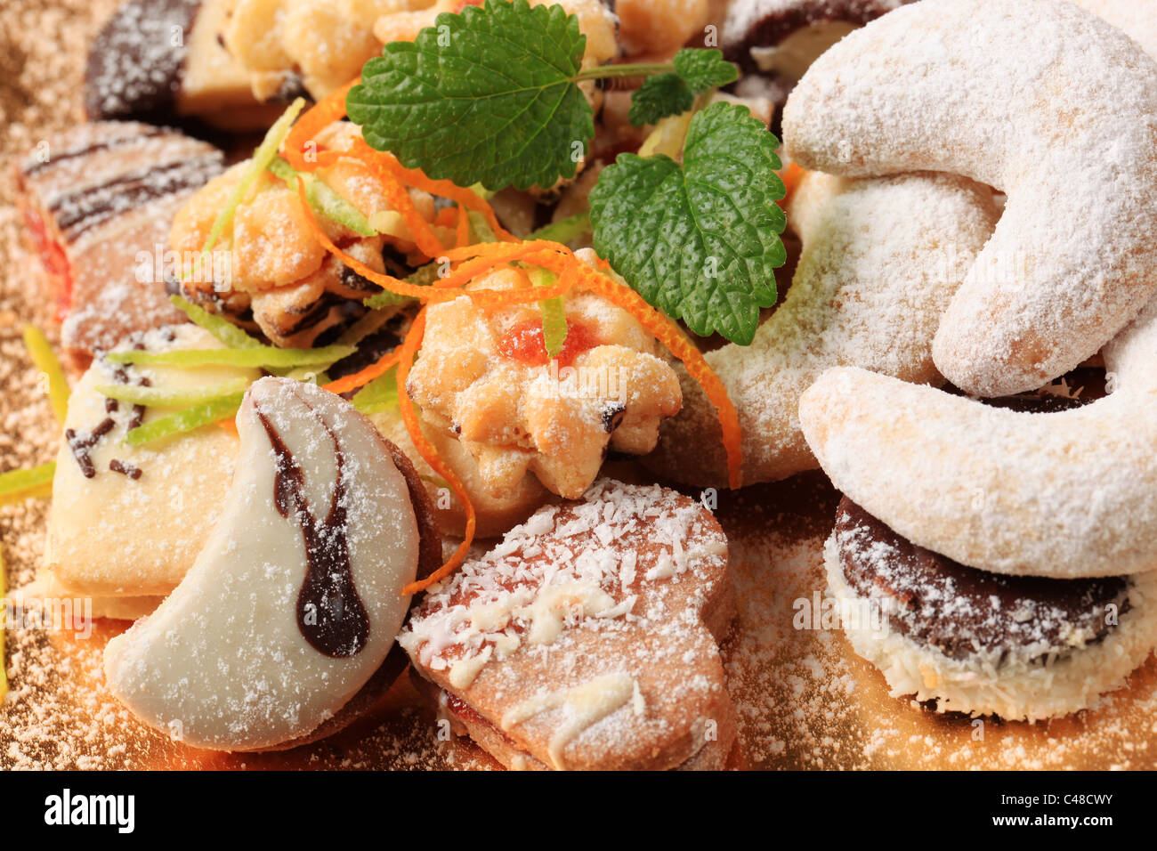 Variety of sweet cookies on golden plate Stock Photo - Alamy
