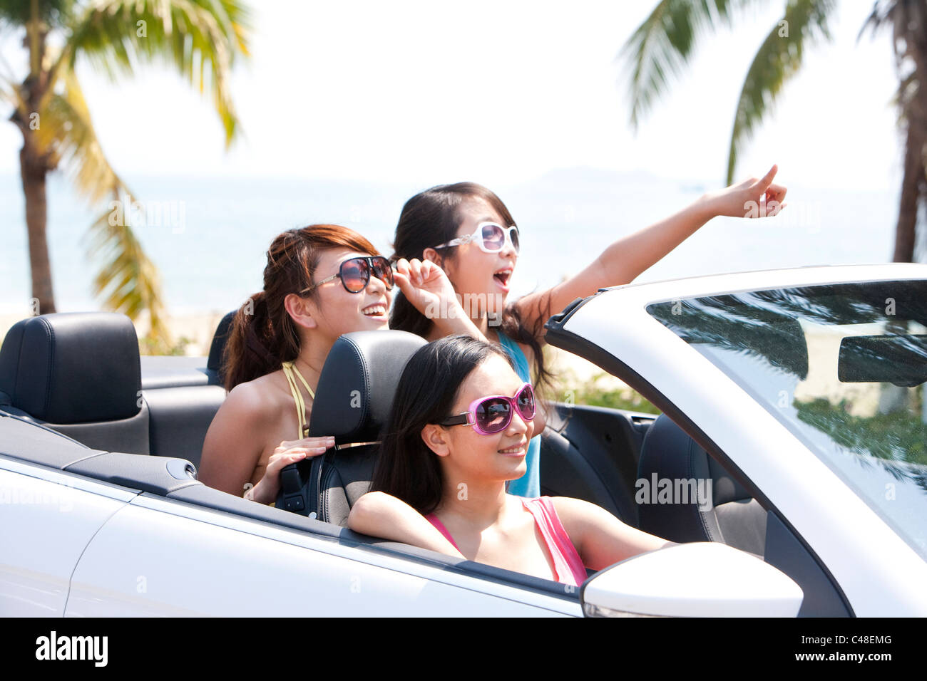 Girlfriends Having Fun in a Convertible Stock Photo - Alamy