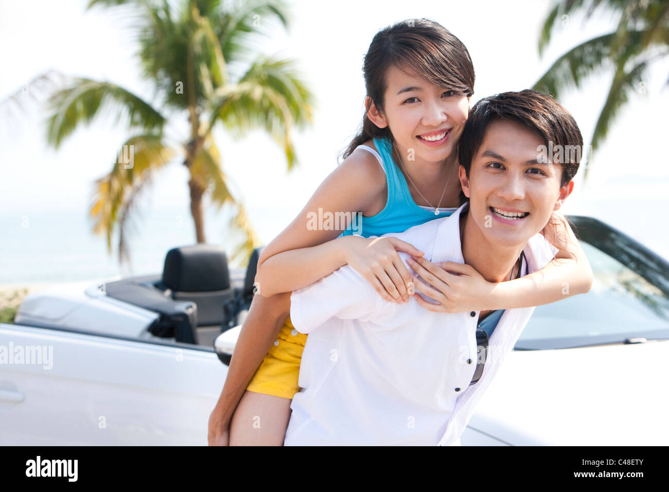 Couple getting down from car hi-res stock photography and images - Alamy