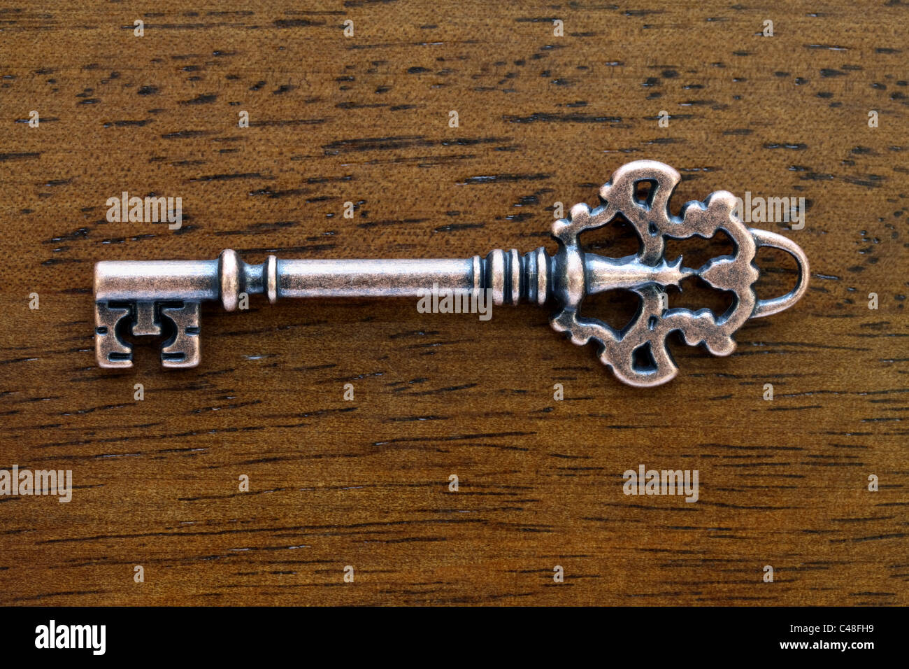 Old key on a wooden table Stock Photo - Alamy