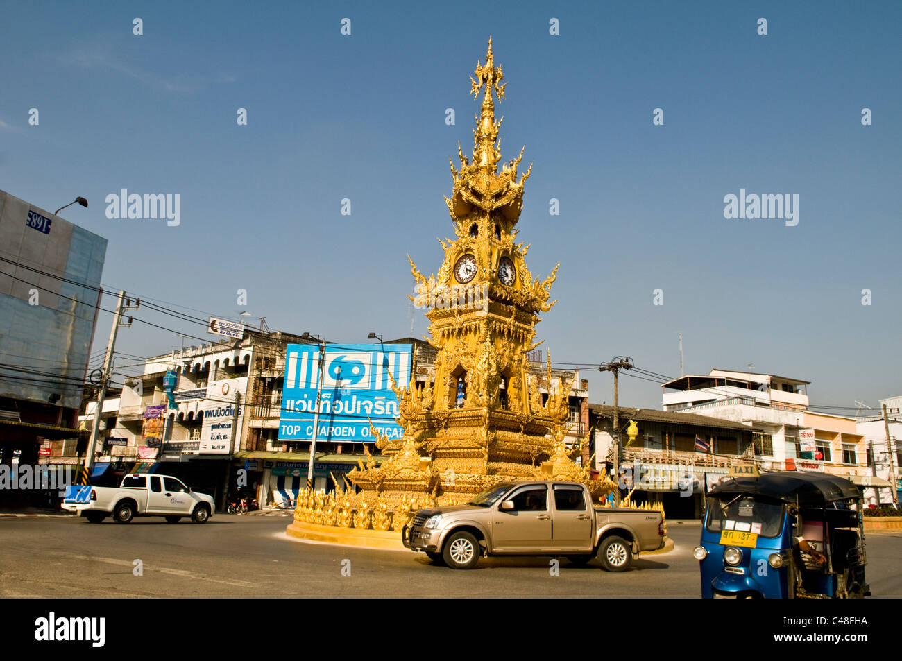 A golden clock tower in downtown Chiang Rai, Thailand Stock Photo - Alamy