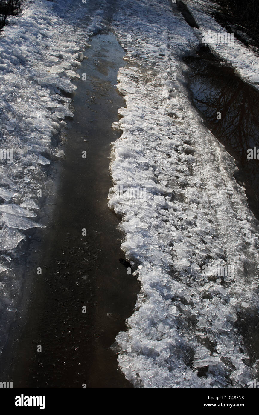 Large pot hole in a tarmac road Stock Photo - Alamy
