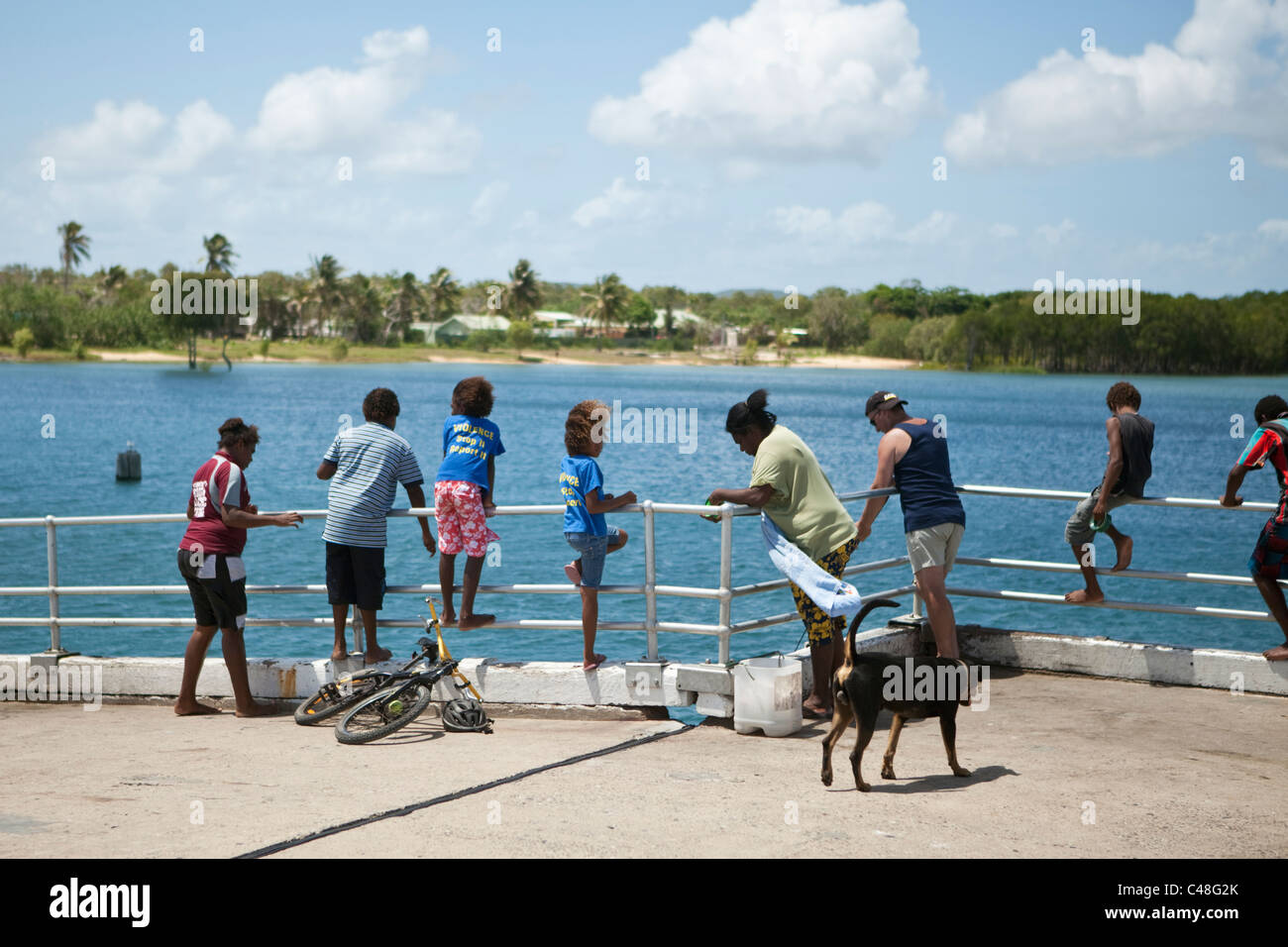 Family fishing off the jetty at Horn Island, Torres Strait Islands ...