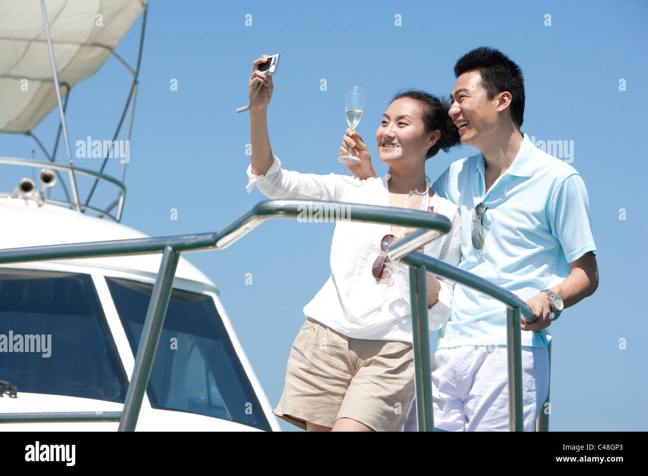 Having Fun on a Yacht Deck Stock Photo - Alamy