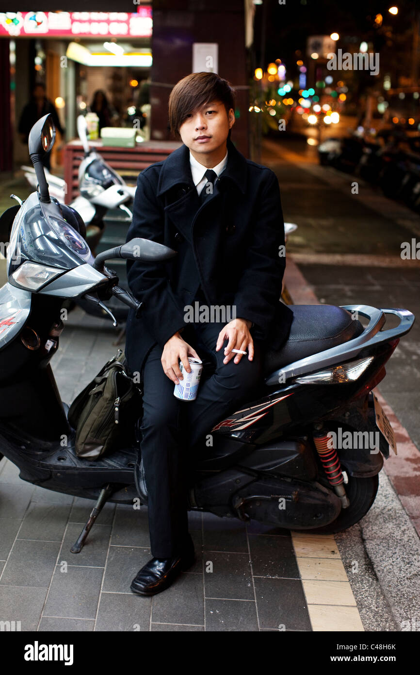 Scooter, beer and a smoke, Taipei, Taiwan, October 28, 2010 Stock Photo ...