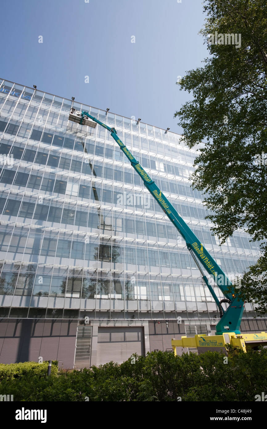 window cleaners working from elevator truck basket Stock Photo - Alamy