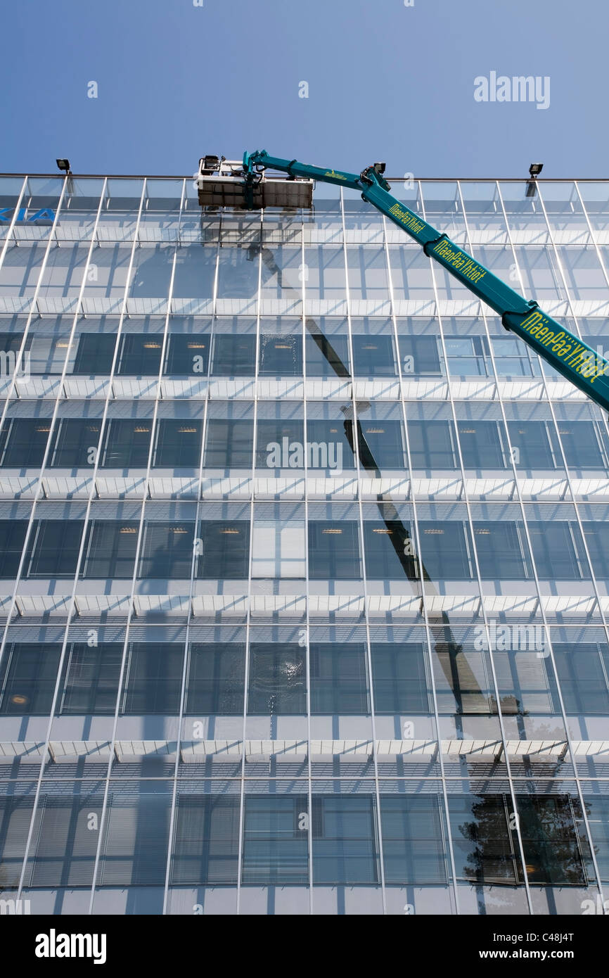 window cleaners working from elevator truck basket Stock Photo - Alamy