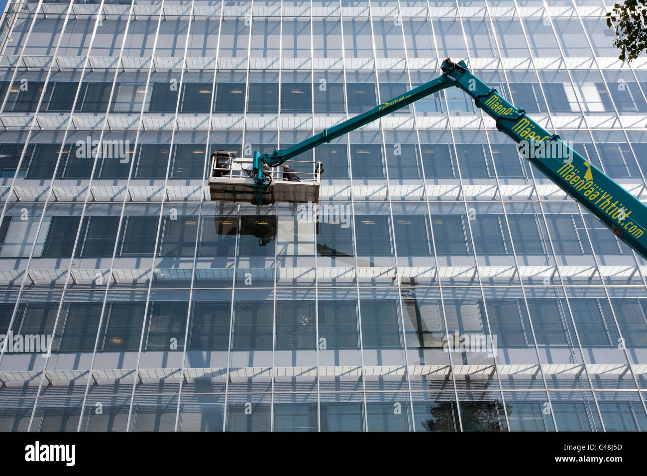 window cleaners working from elevator truck basket Stock Photo - Alamy