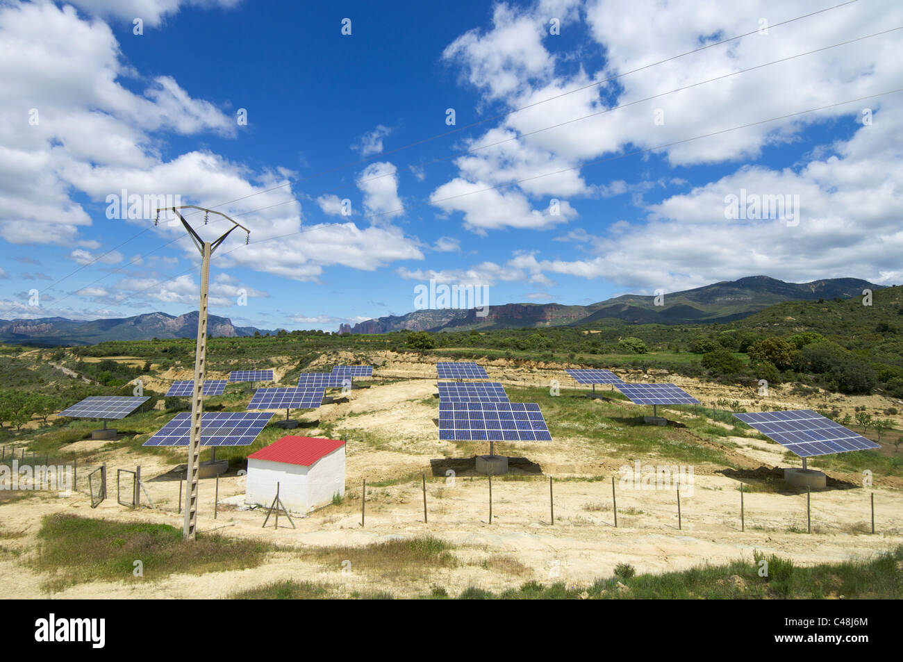Solar field with blue sky with clouds Stock Photo - Alamy