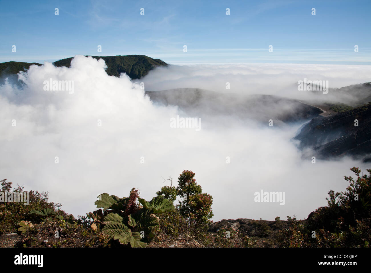 By clouds limited view of the Poas volcano crater. Near San Jose, Costa ...