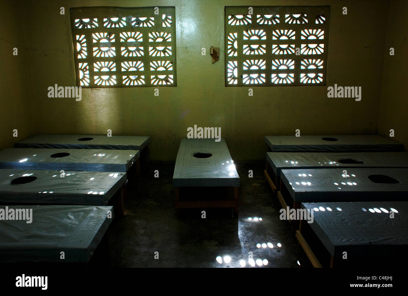 Nine cholera beds in a poorly lit room waiting for patients Stock Photo ...