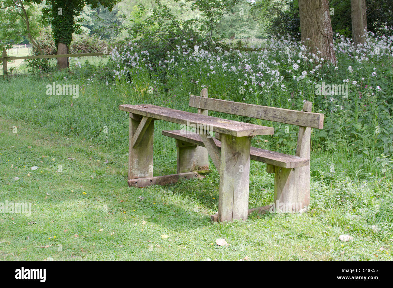 Wooden bench and table in a rural setting Stock Photo - Alamy