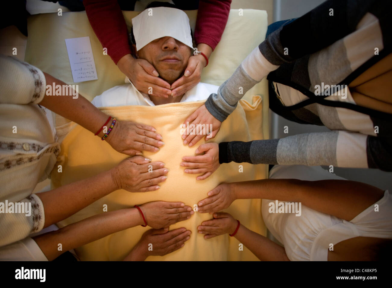 A man receives Reiki by a group of students in Mexico City Stock Photo ...