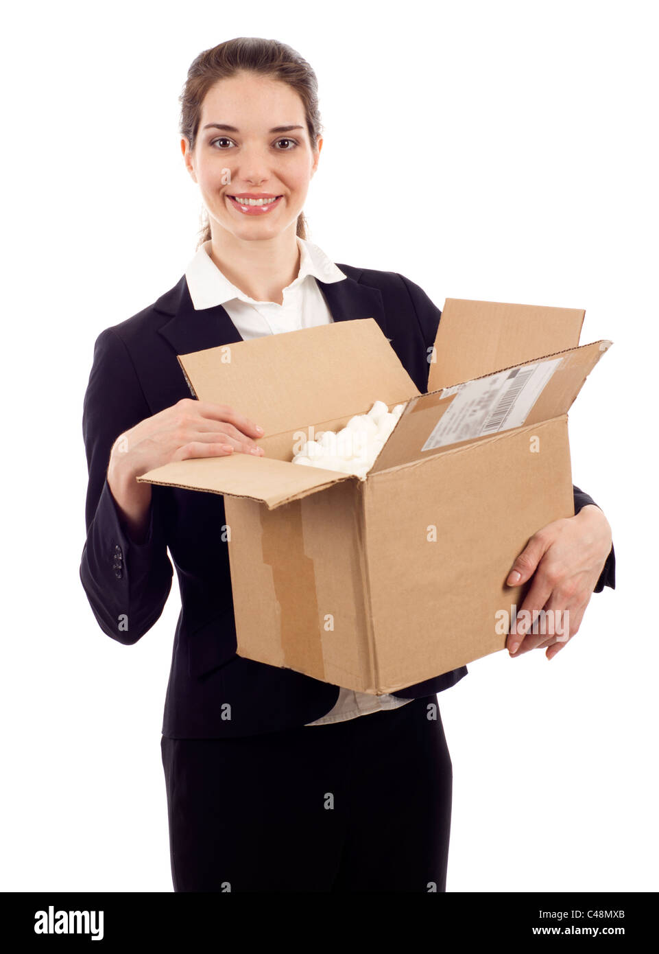 Happy beautiful woman receving a postal package isolated over white ...