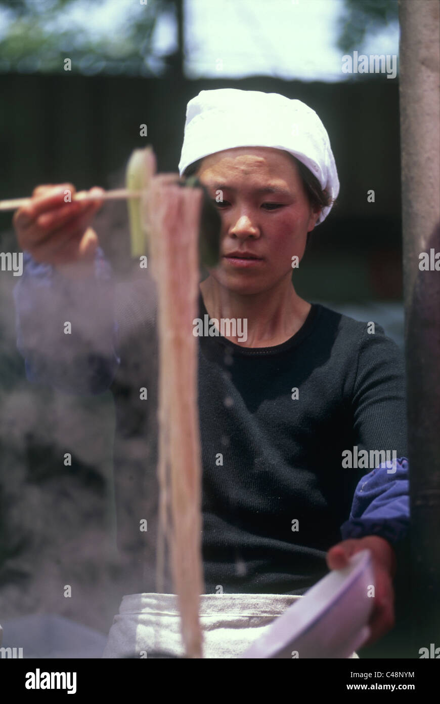 Photograph of a Chinese woman in a local market Stock Photo - Alamy