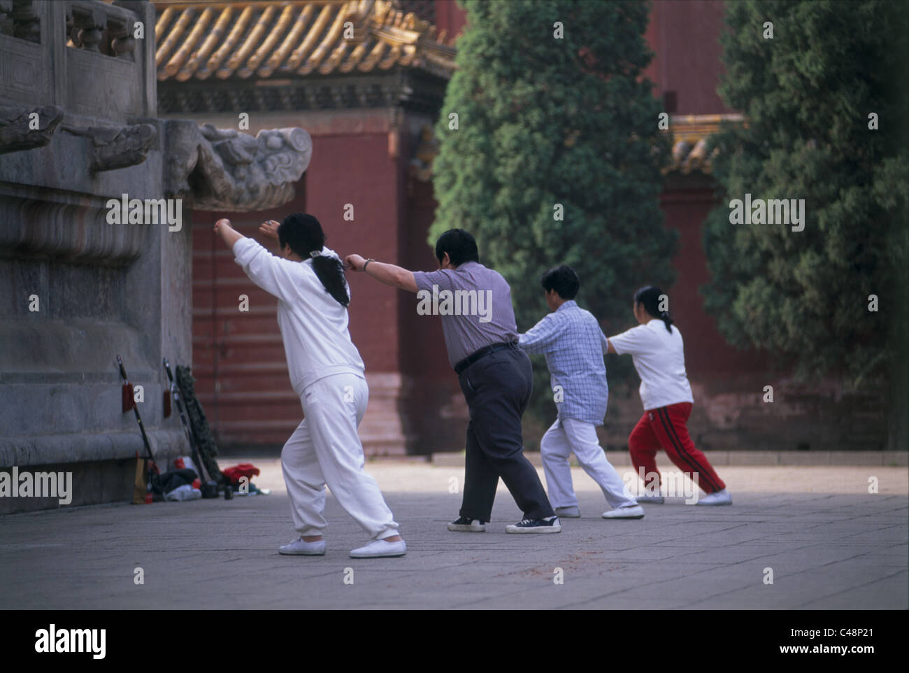 Photograph of four chinese pepole during morning exercises at Beijing ...