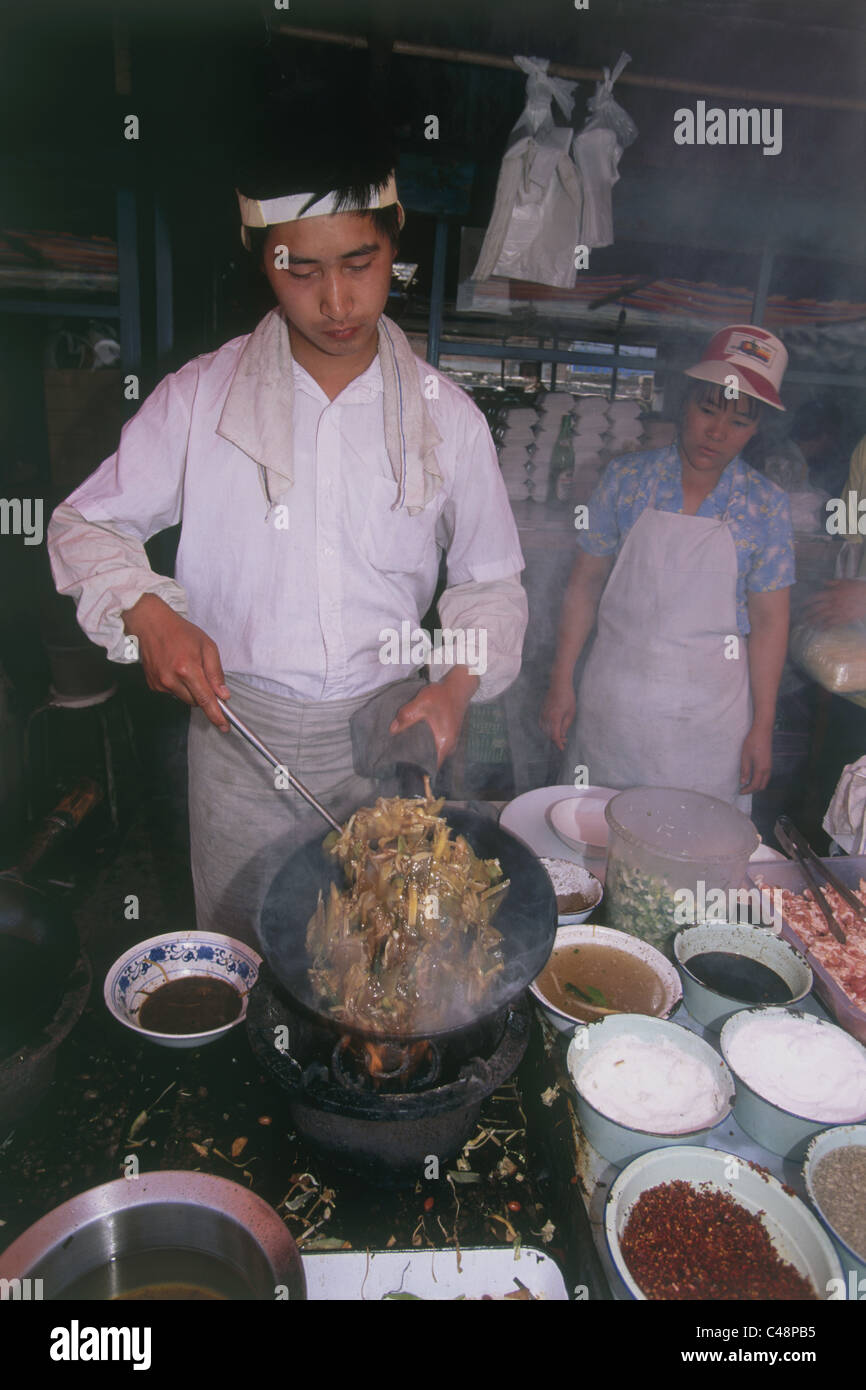 Photograph of a Chinese cook in action Stock Photo - Alamy