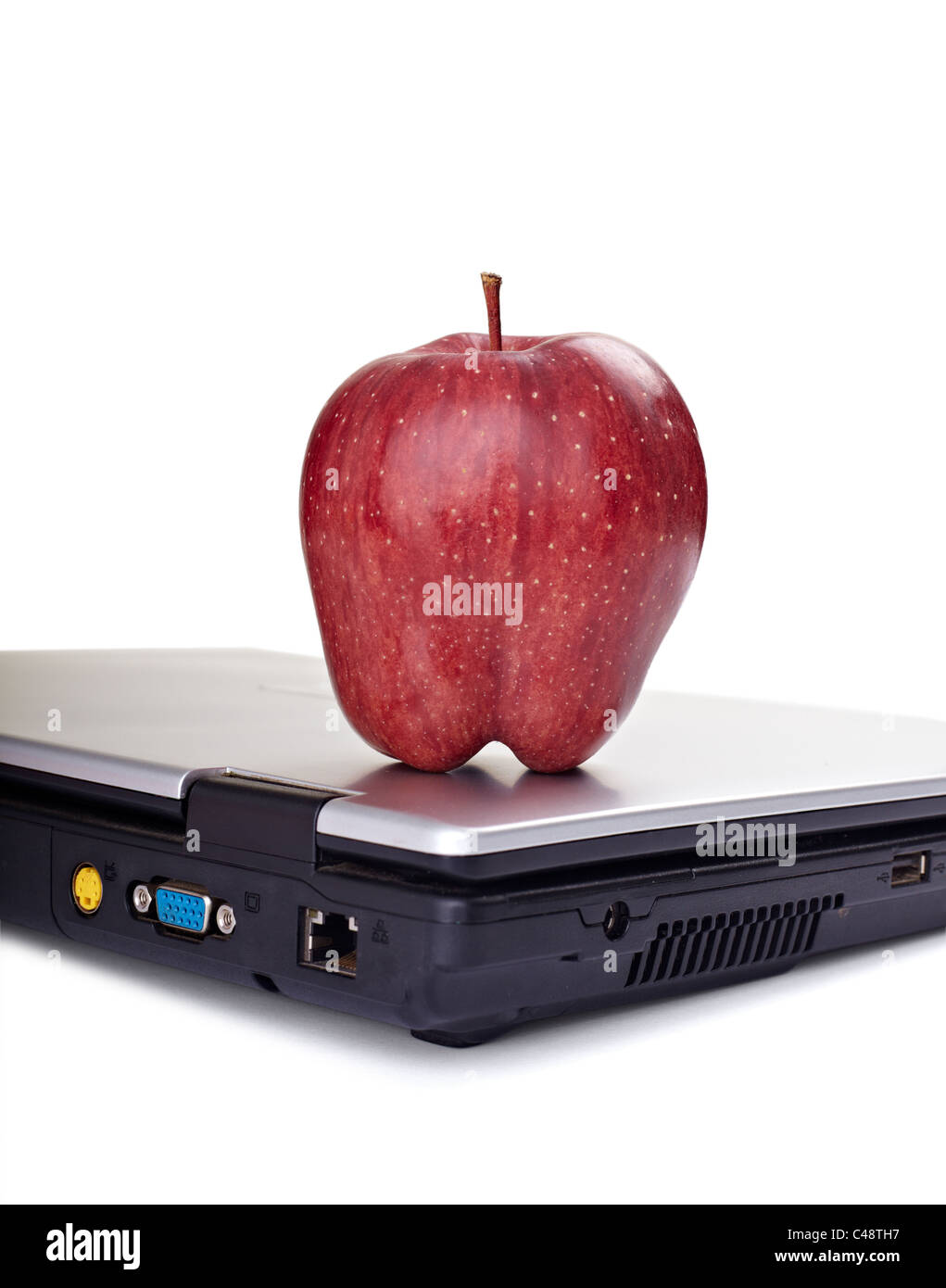 laptop and an apple Stock Photo - Alamy