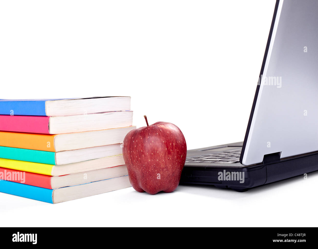 laptop, books and an apple Stock Photo - Alamy