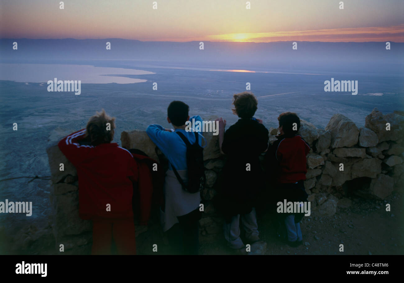 Four children on top of Masada at sunrise Stock Photo - Alamy