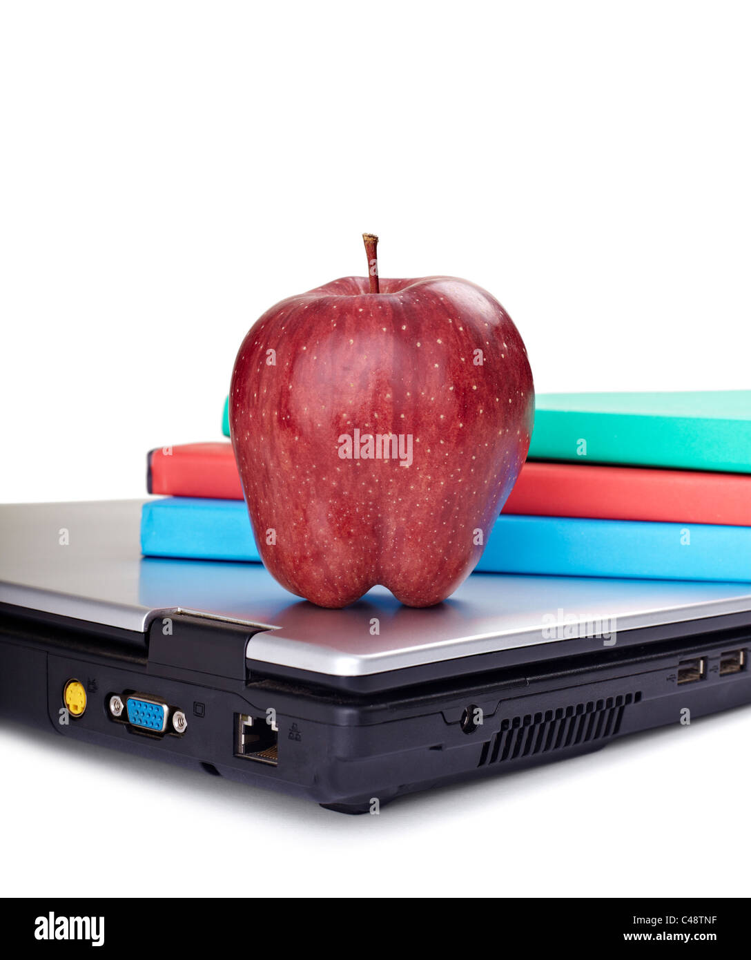 laptop, books and an apple Stock Photo - Alamy